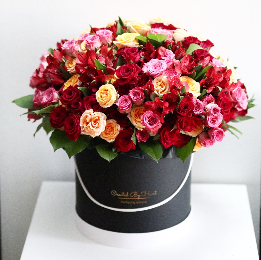 Mixed color spray roses in a hatbox - CREATED BY HEART